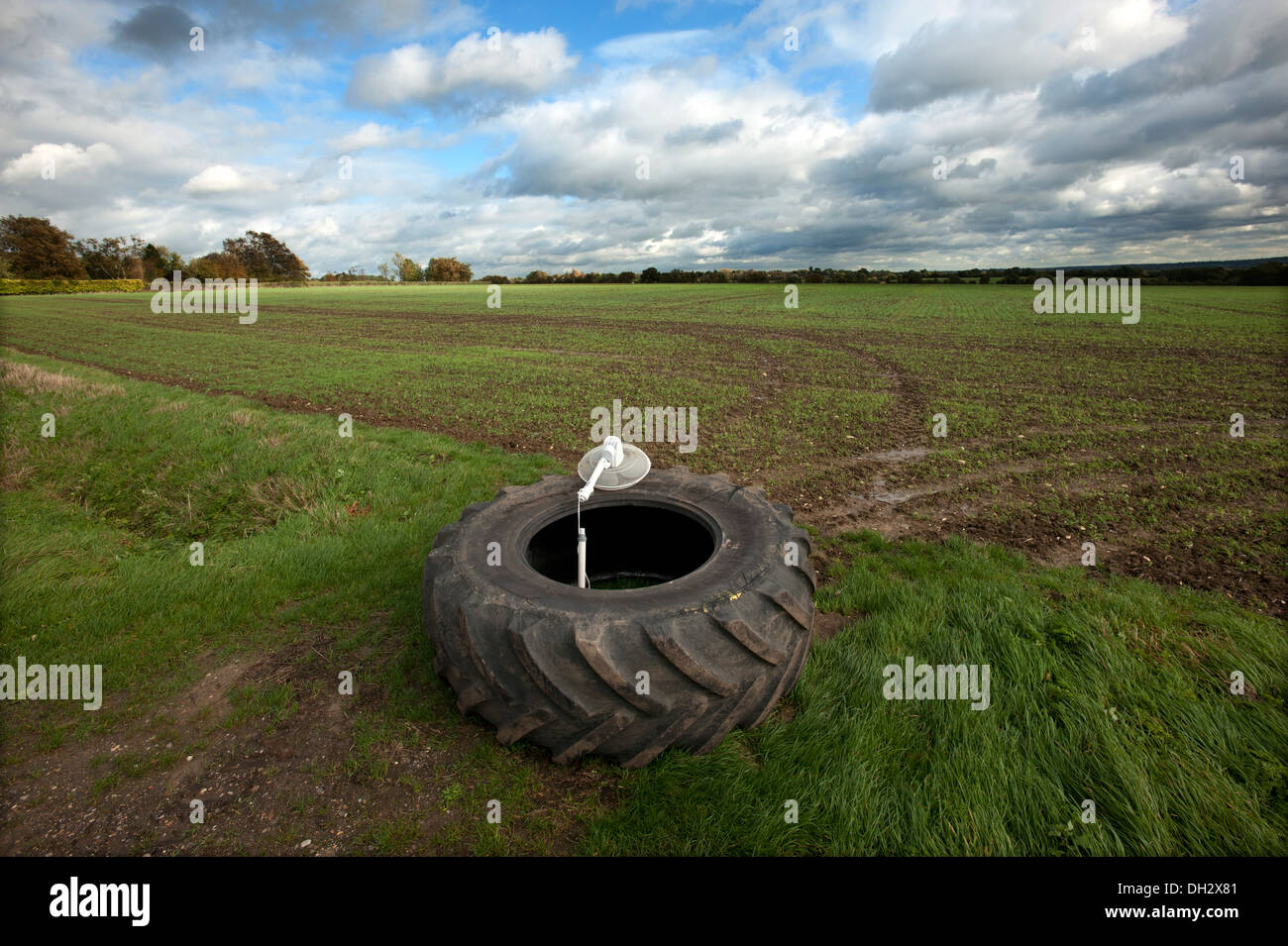 Tractor Tyre in a Field with a Fan. Essex, England, UK. 28 October 2013 ...