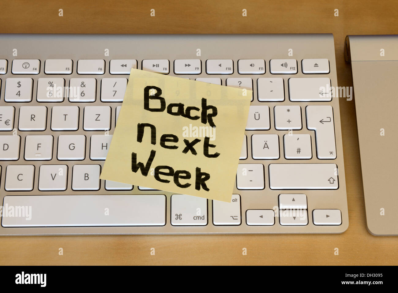 'Back next week' post it note on computer keyboard Stock Photo - Alamy