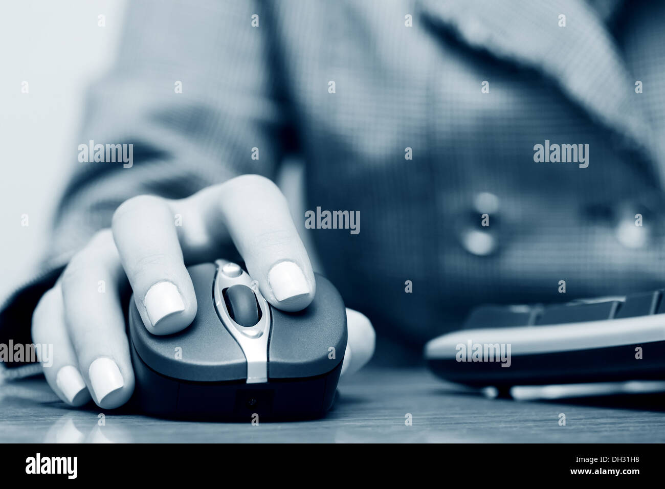 Female hand holding computer mouse Stock Photo - Alamy