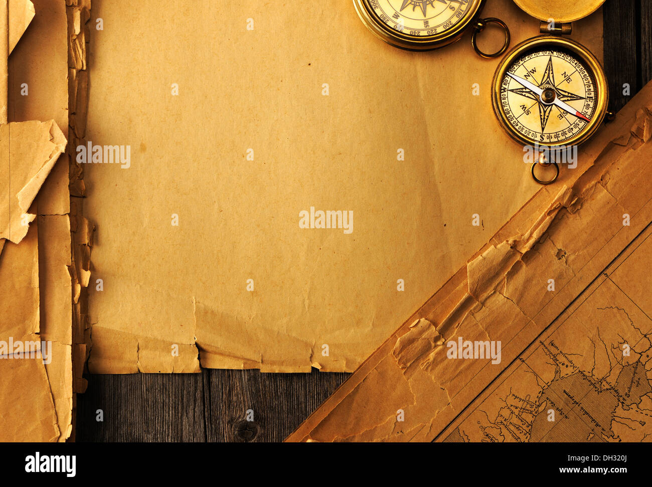 Antique compass over old map Stock Photo - Alamy