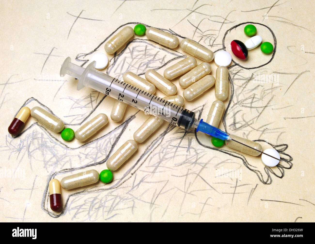 Pills and a syringe are placed in the form of a human figure Stock ...