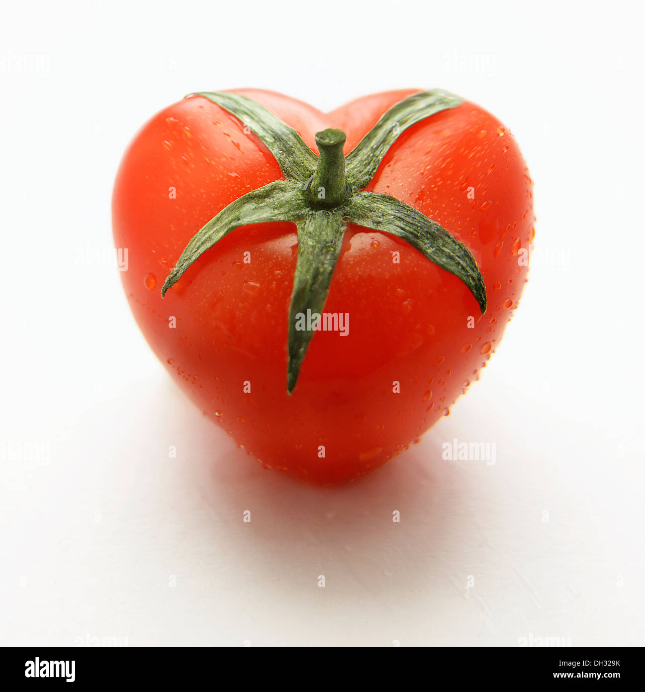 Tomato in the shape of a heart Stock Photo - Alamy