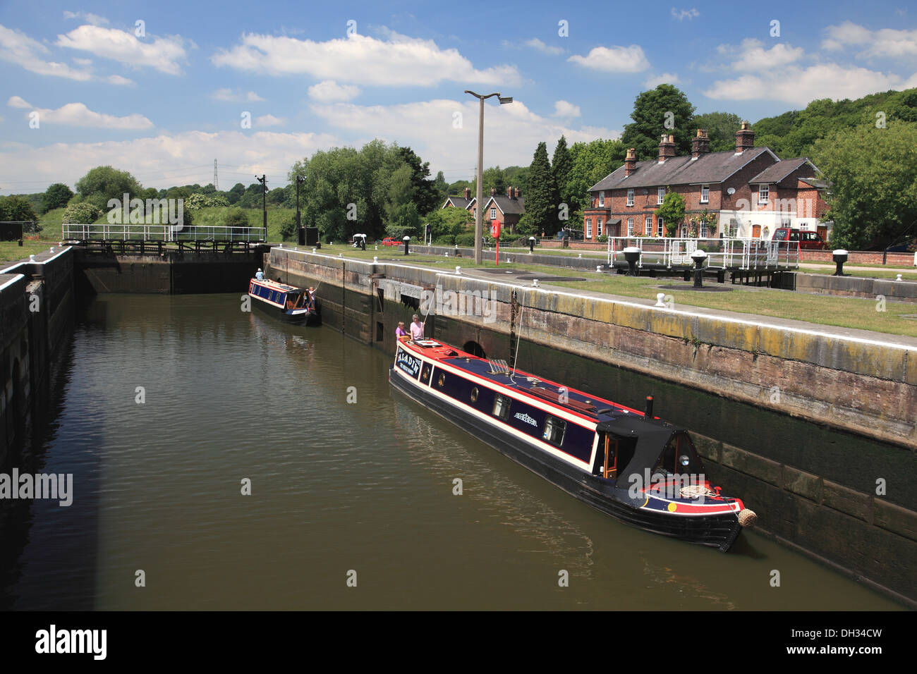 A narrowboat in the deep wide lock at Saltersford Locks No. 3 on the ...