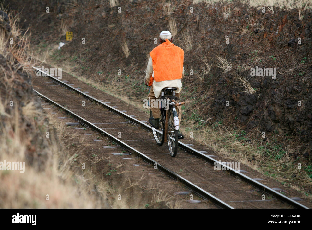 Man riding on bicycle on railway tracks Miraj Maharashtra India Asia ...