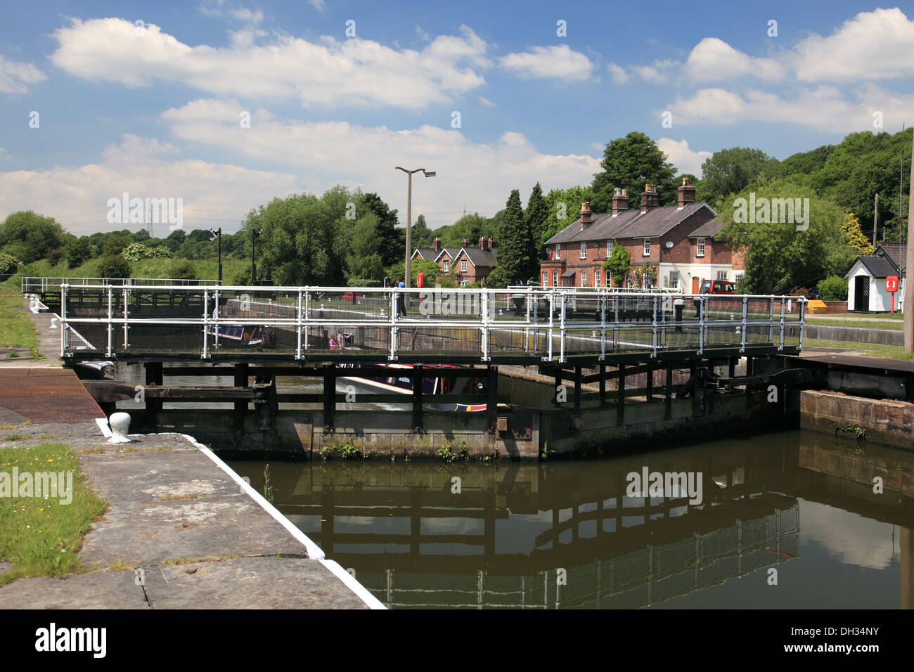 Two narrowboats in the deep lock, the lock gates closed, at Saltersford ...