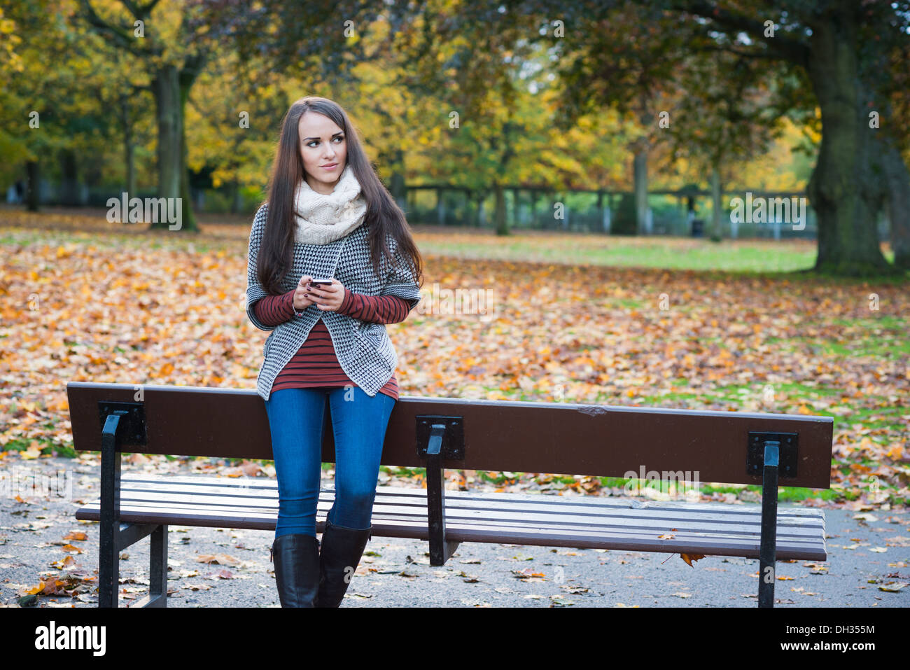 Leaning on a bench hi-res stock photography and images - Alamy