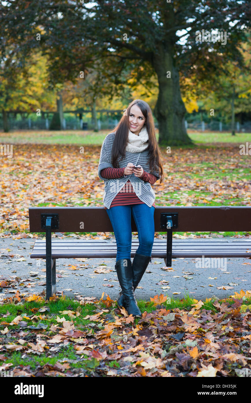 Leaning on a bench hi-res stock photography and images - Alamy