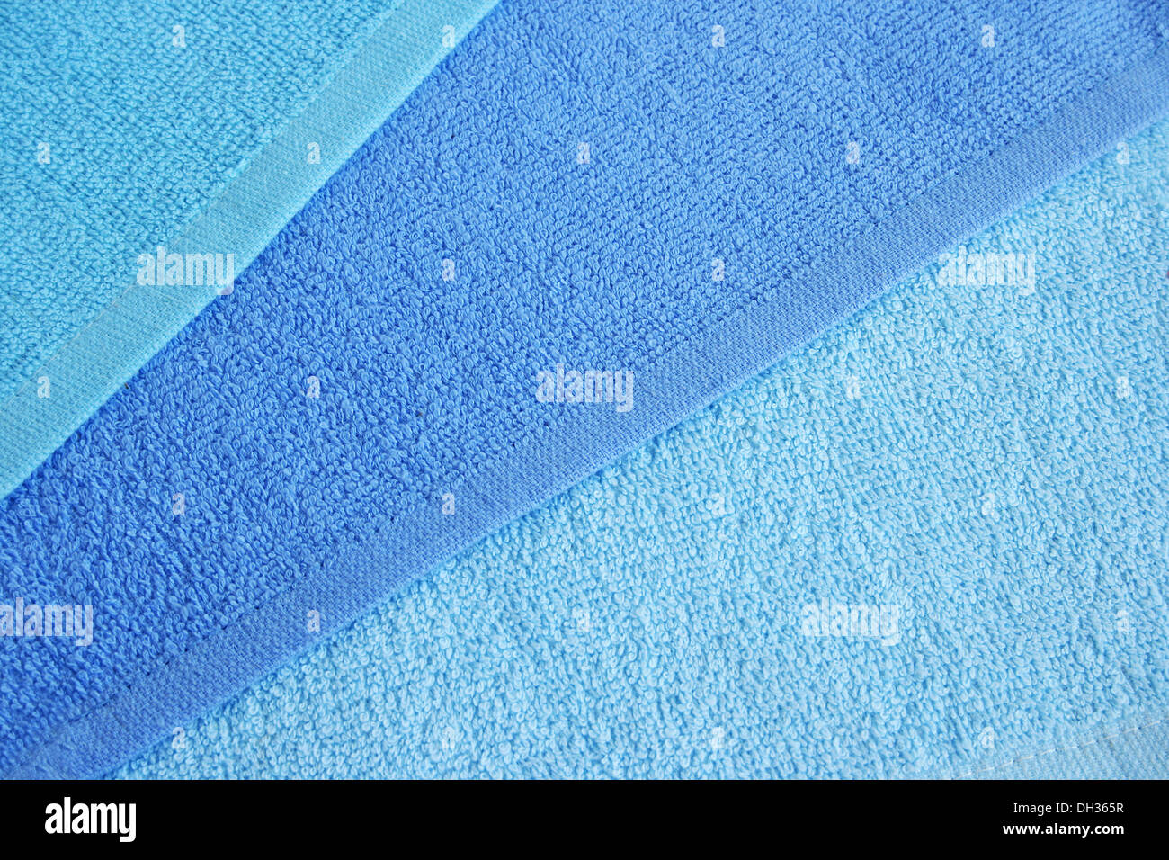 Three blue towels texture as a background Stock Photo - Alamy