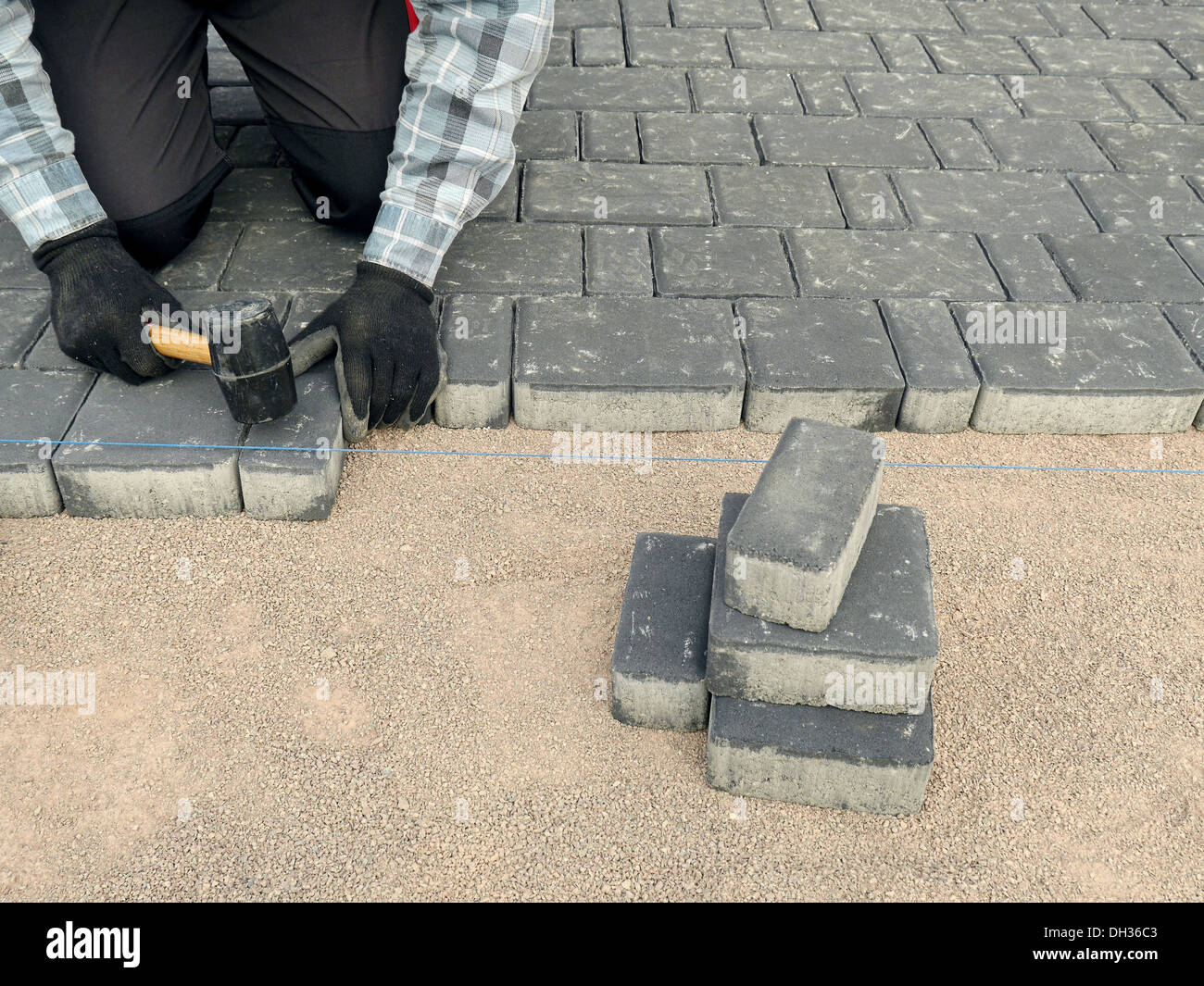 Paver laying driveway pavement out of concrete pavement blocks Stock ...