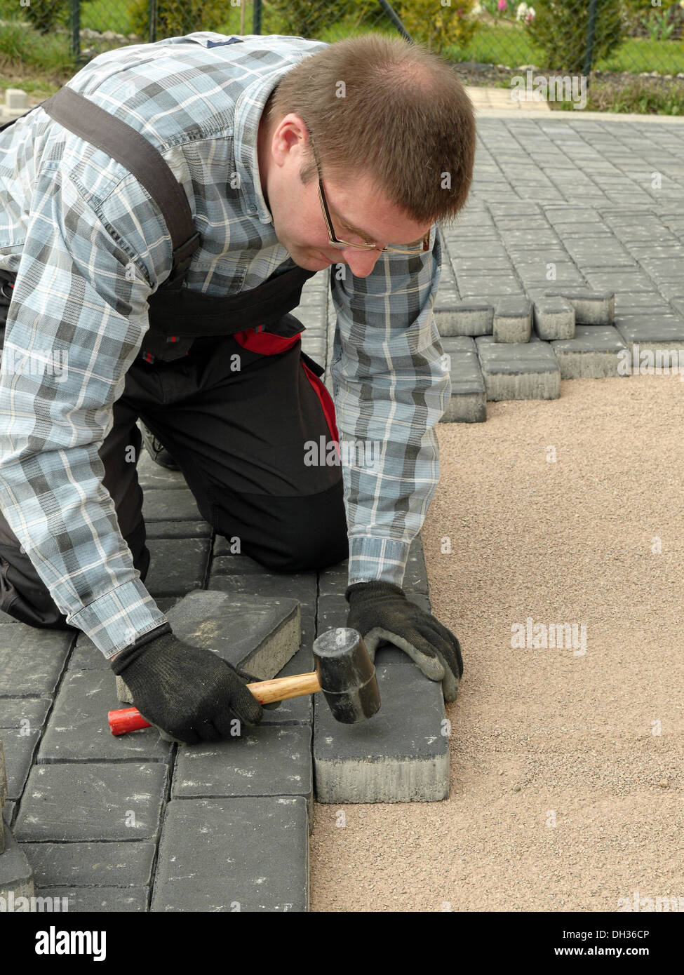 Paver laying driveway pavement out of concrete pavement blocks Stock ...