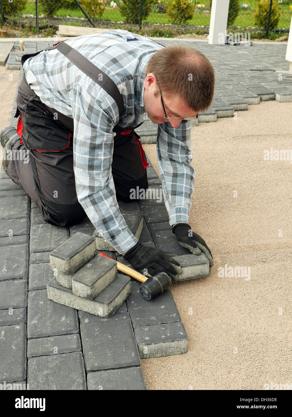 Paver laying driveway pavement out of concrete pavement blocks Stock ...