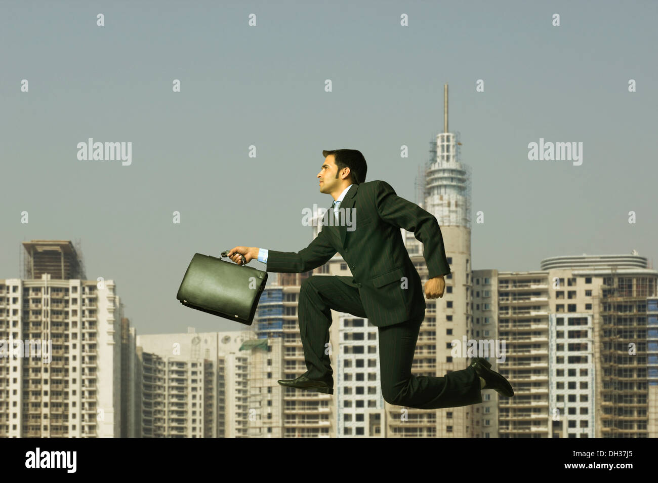 Side profile of a businessman getting late Stock Photo - Alamy