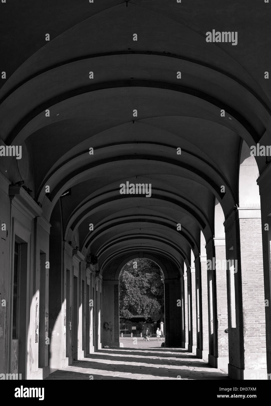 A black and white contrasting view of a vaulted ceiling walkway in ...