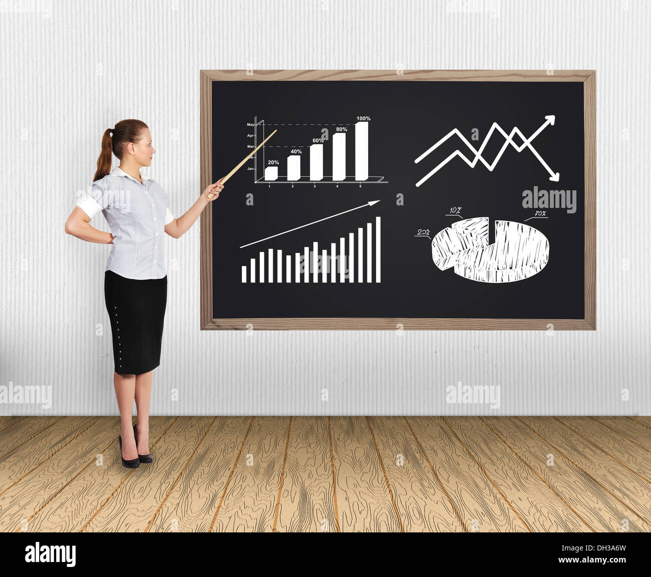 businesswoman in office pointing at charts Stock Photo - Alamy