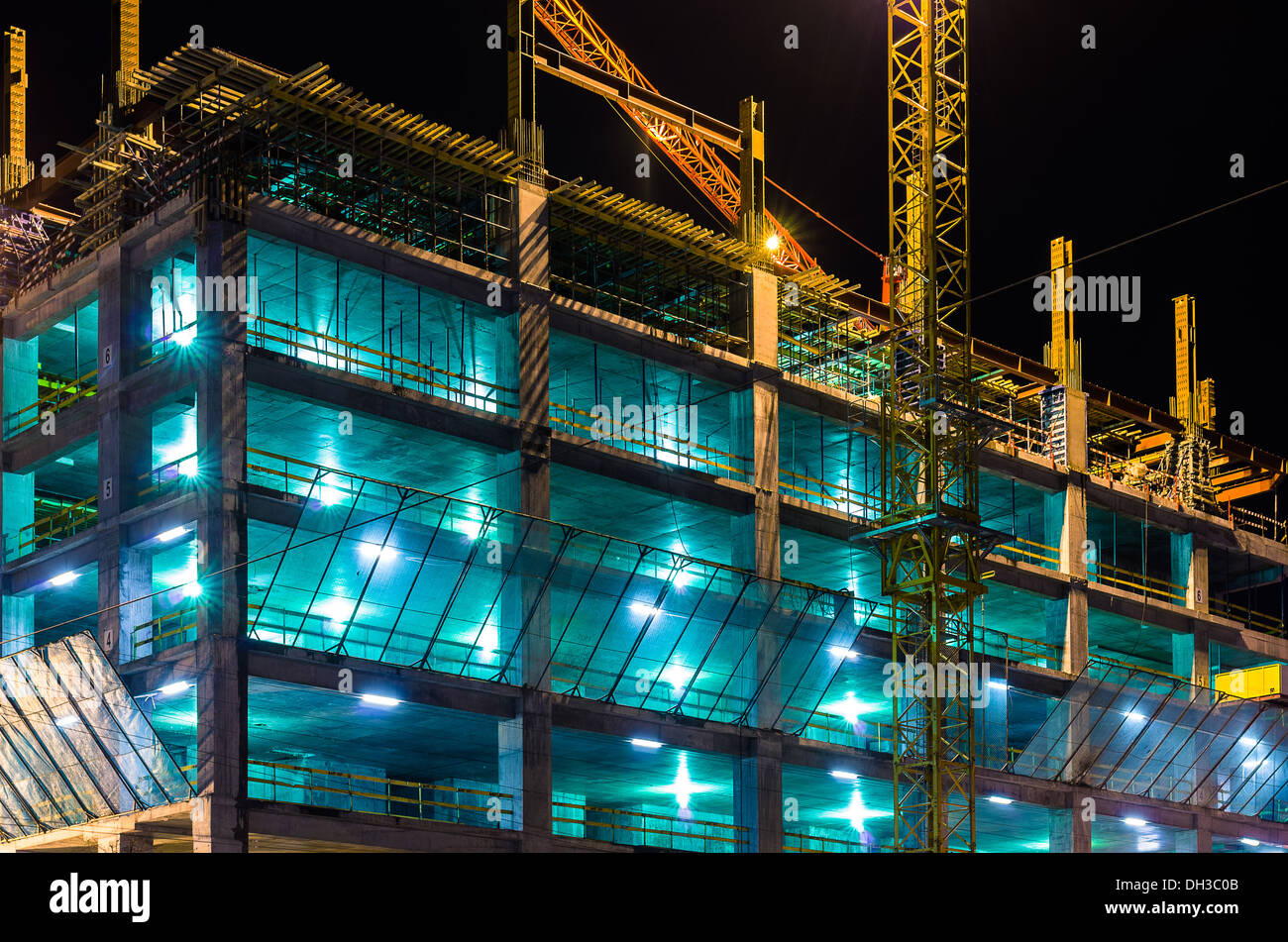 Construction at night with lights against the dark sky Stock Photo - Alamy