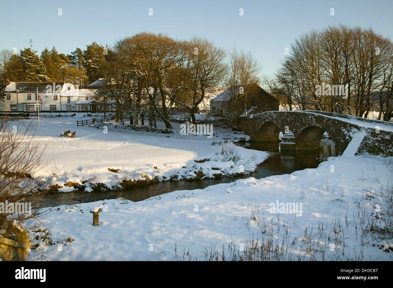 Coach bridge, West Dart River and hotel in snowy conditions, at Two ...