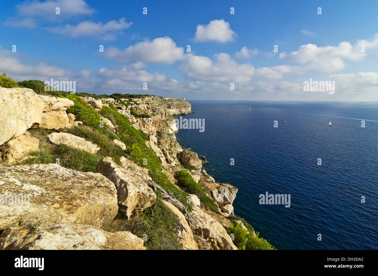 Coastal cliffs with a lighthouse at Cabo Blanco, Tolleric, Majorca ...
