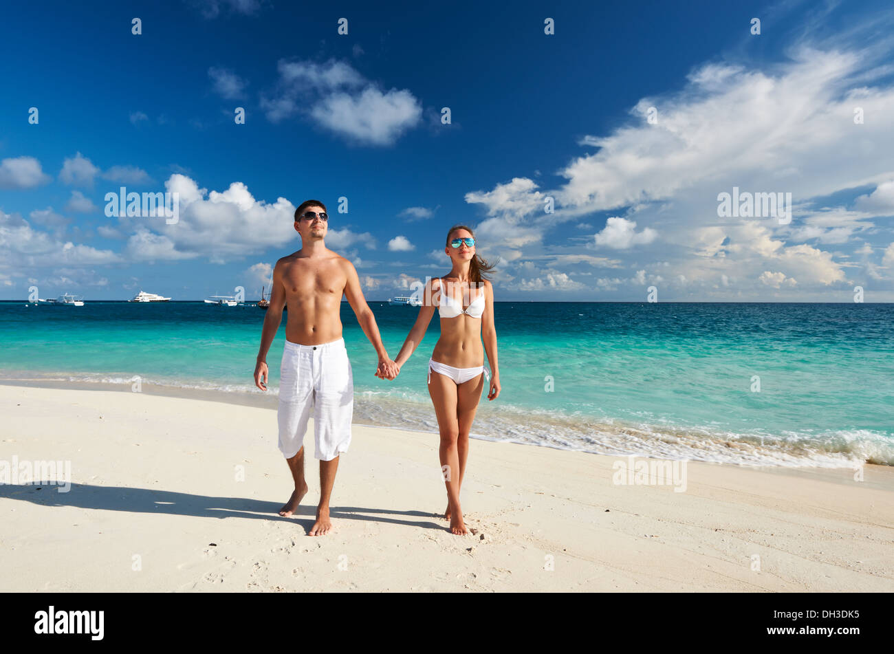 Couple on a beach at Maldives Stock Photo - Alamy