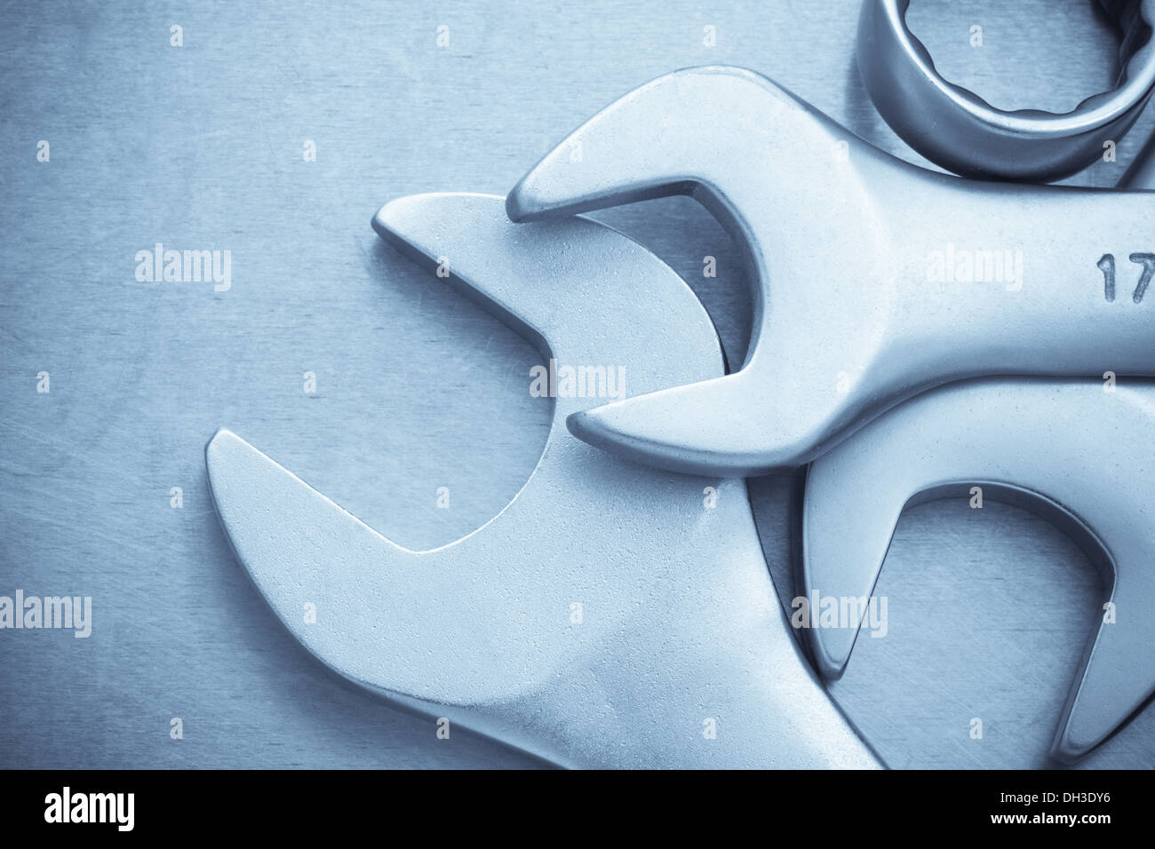 wrench tool at metal background Stock Photo - Alamy