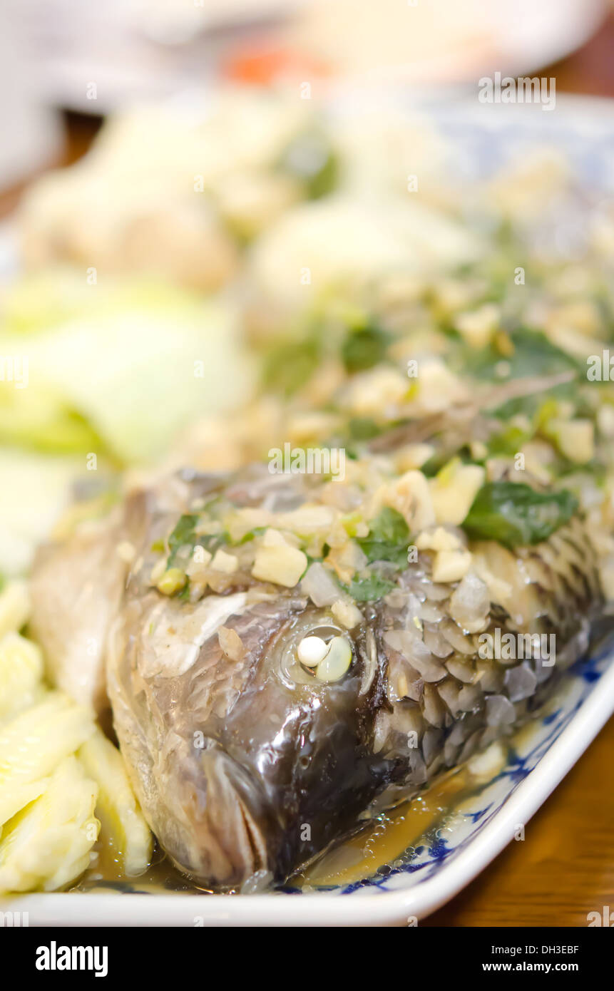 steamed fish with garlic , herbs and vegetable Stock Photo - Alamy