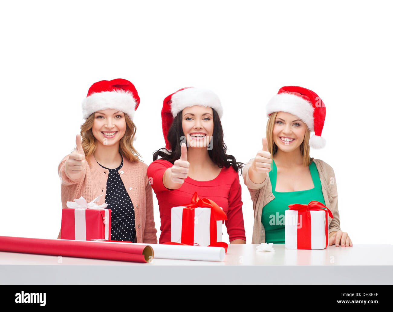 smiling women in santa helper hats with gift boxes Stock Photo - Alamy
