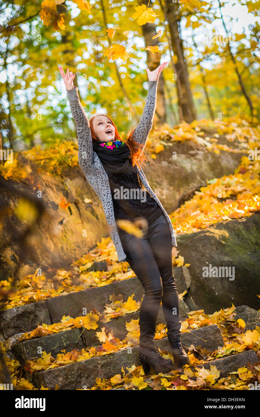 Beautiful girl and falling leaves, colors of fall Stock Photo - Alamy