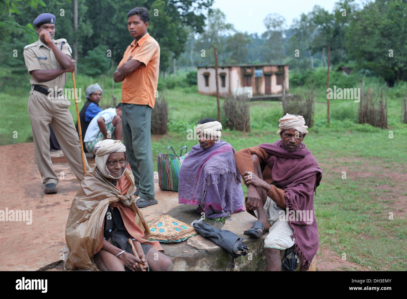 Tribal people and policeman. Baiga Tribe, Chada village, Madhya Pradesh ...
