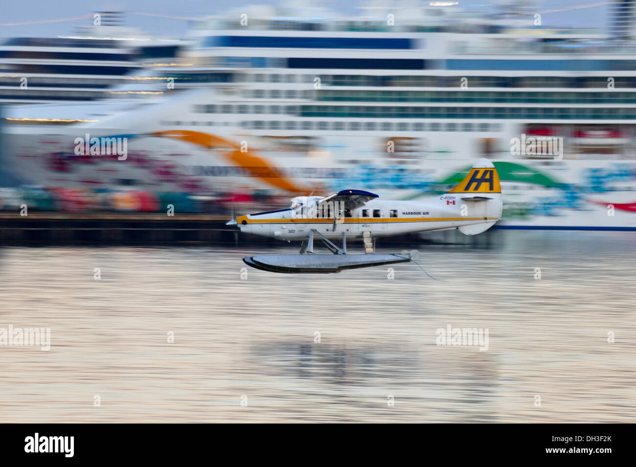 Float plane preparing to land in Inner Harbor at dusk-Victoria, British ...