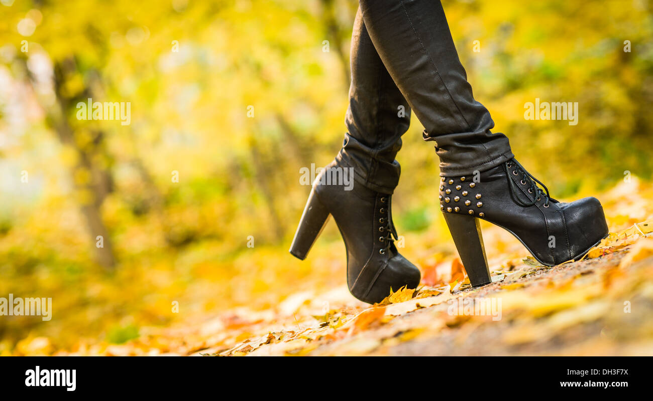 Girl with a high heels on the park, colors of autumn Stock Photo - Alamy