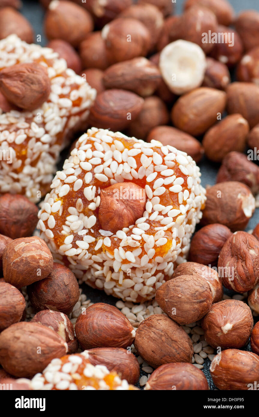 Dried apricots with sesame seeds and hazelnuts Stock Photo - Alamy