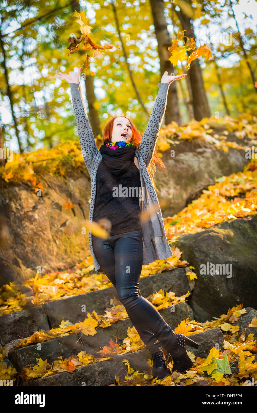 Beautiful girl and falling leaves, colors of fall Stock Photo - Alamy