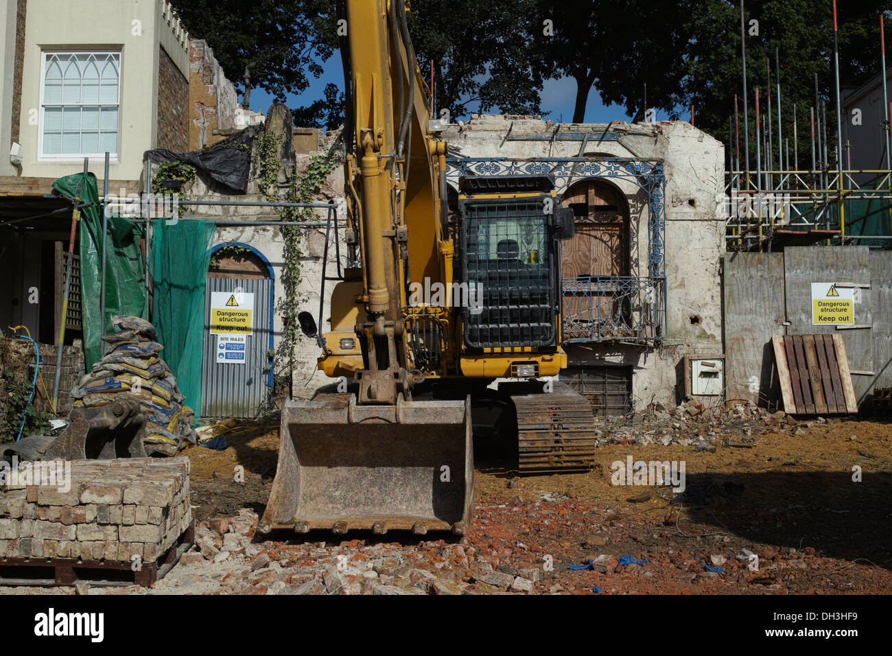 demolition of house with rubble and excavator Stock Photo - Alamy