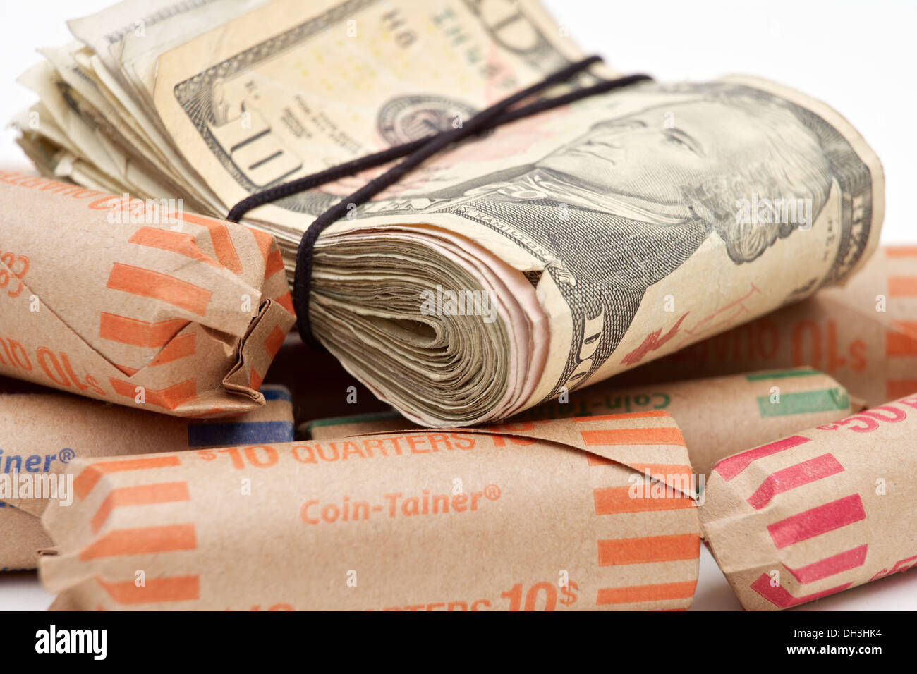 Coloseup of a folded and rubber banded wad of cash laying on top of a ...