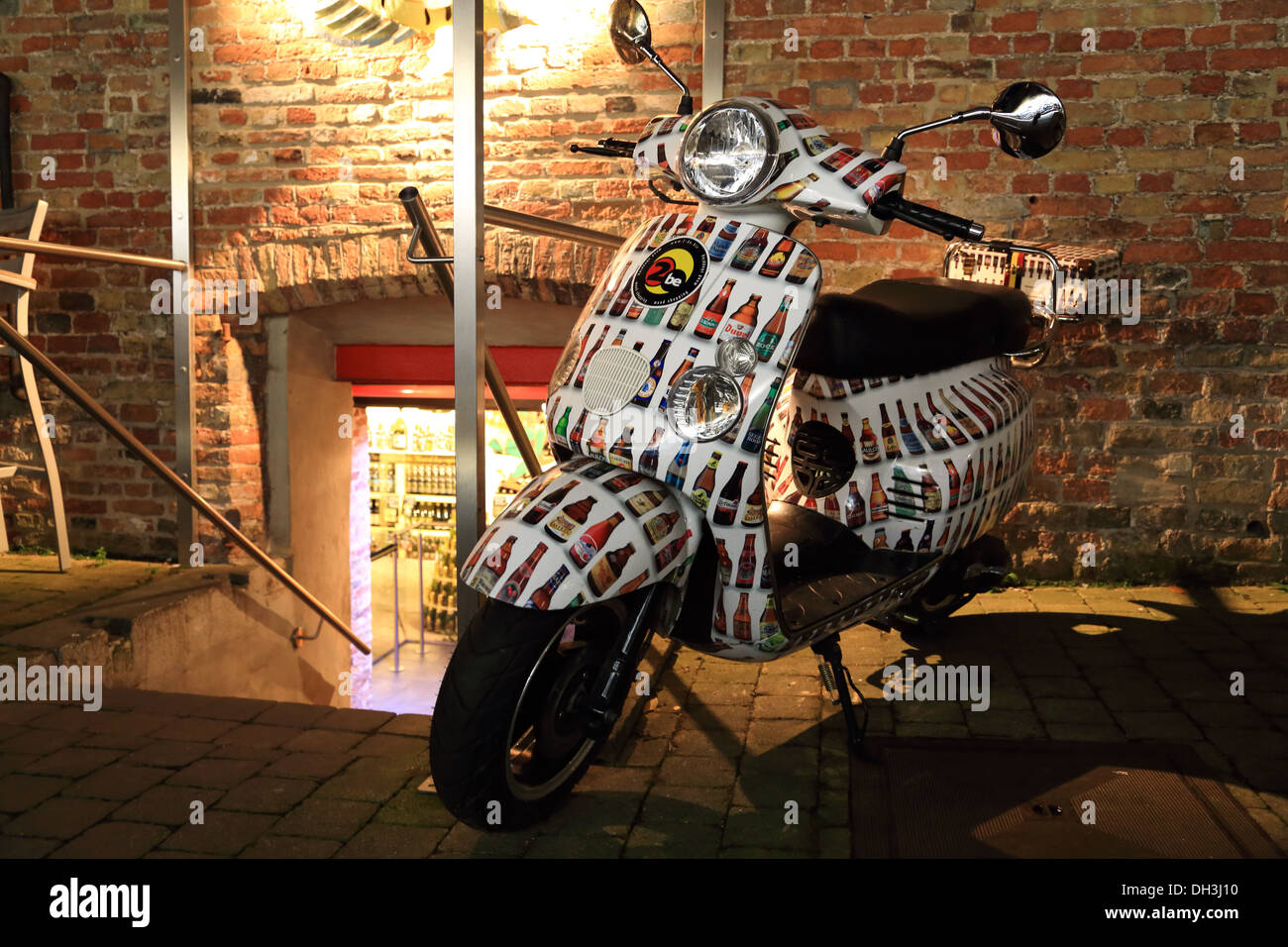Vespa scooter with many stickers of different belgian beers on it ...