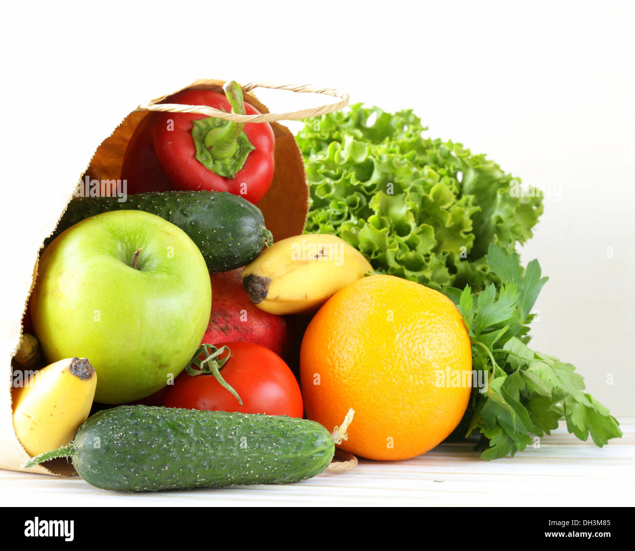 set of different convenience food (vegetables fruit) in a paper bag ...