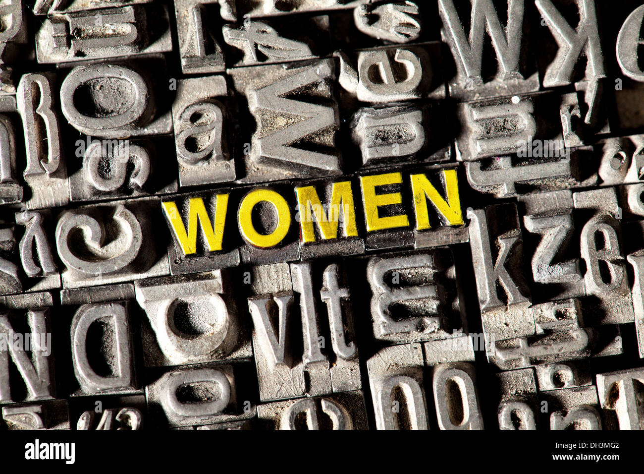 Old lead letters forming the word WOMEN Stock Photo - Alamy