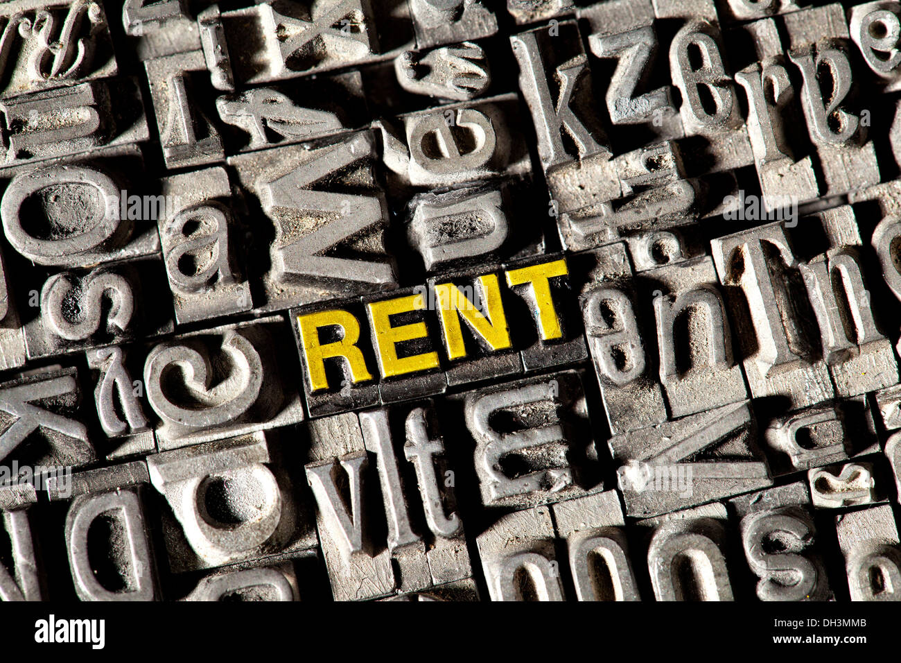 Old lead letters forming the word "RENT Stock Photo - Alamy