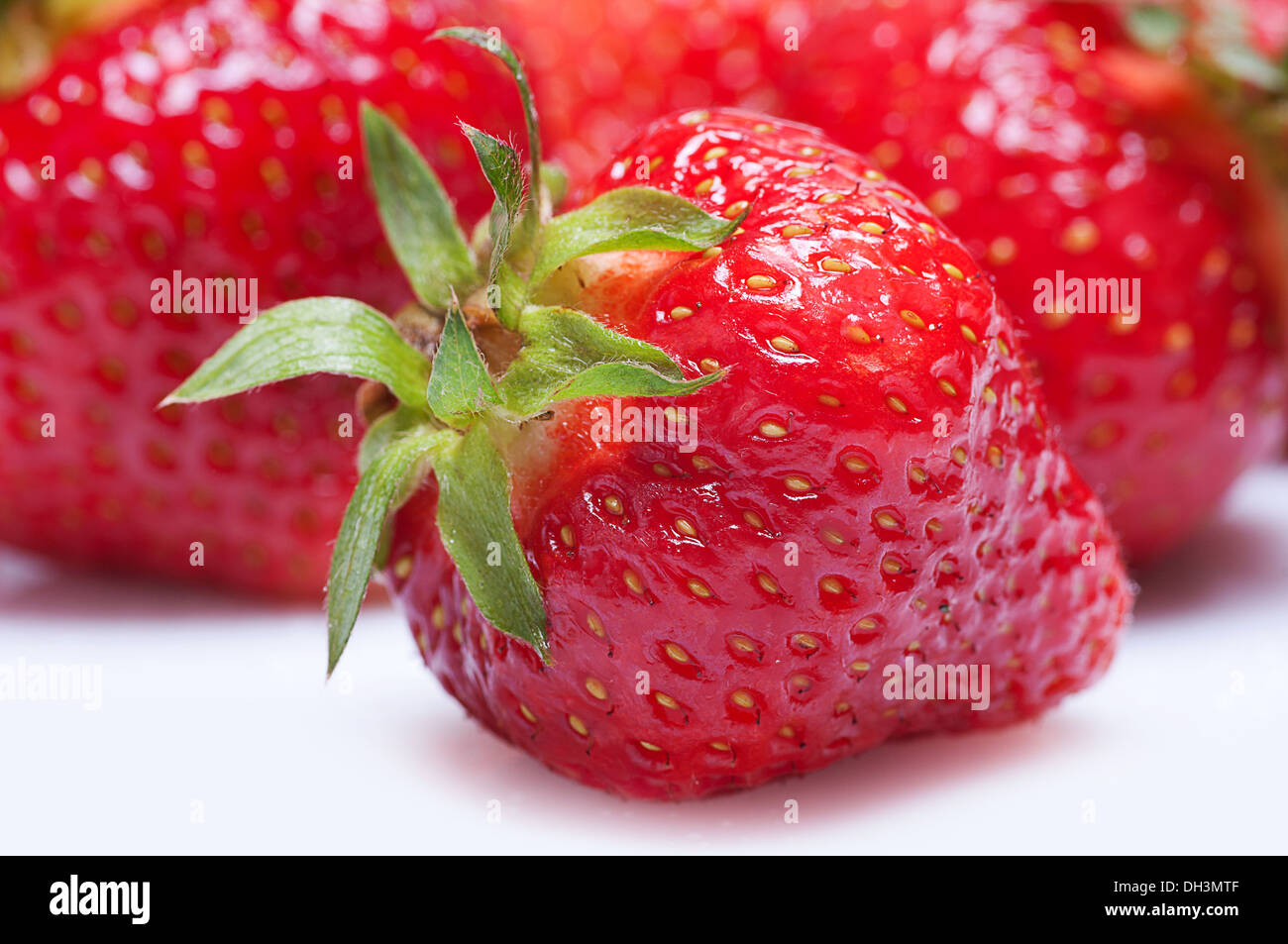 Strawberry with other strawberries Stock Photo - Alamy