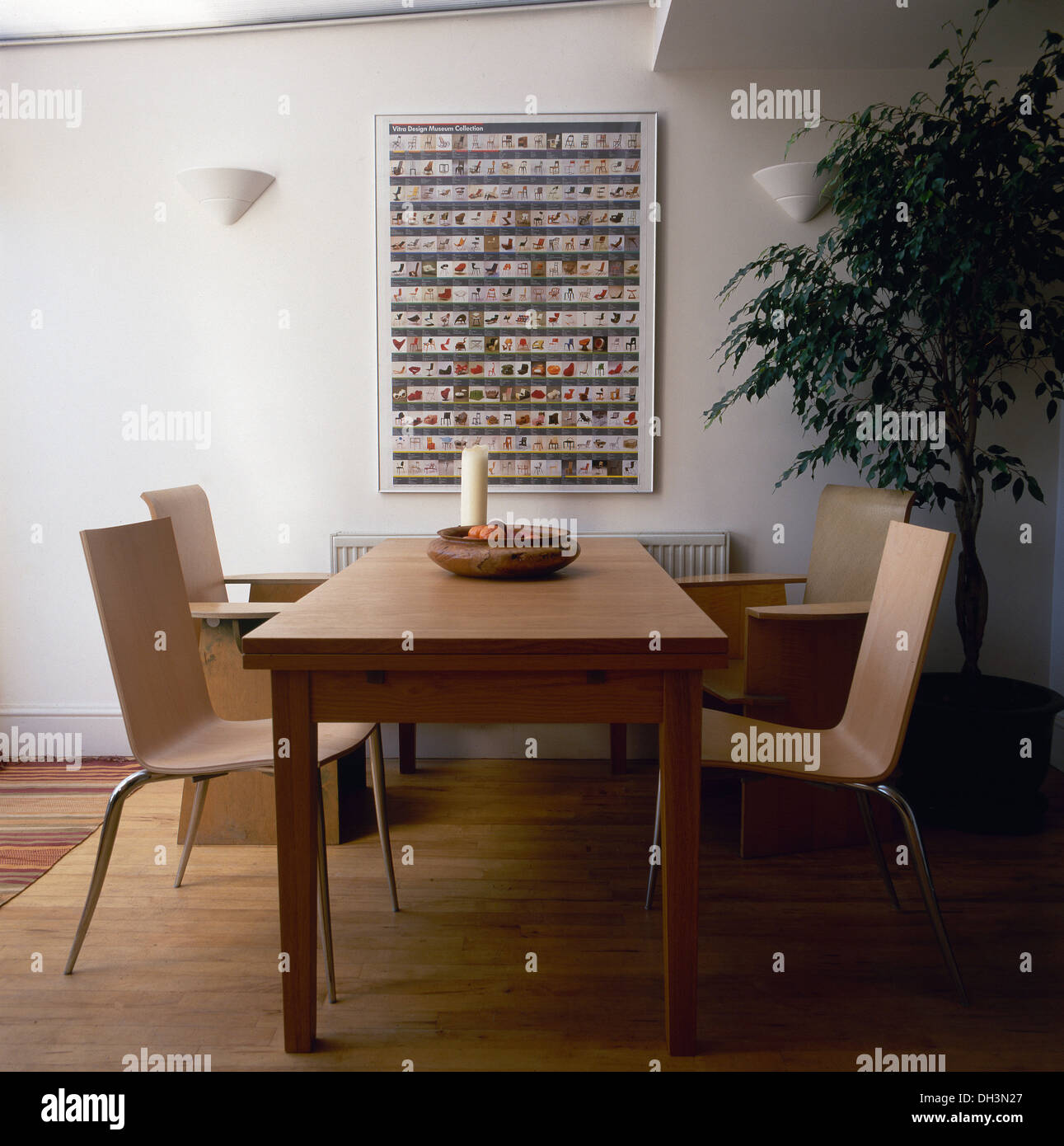 Simple pine table with chrome and pale wood chairs in modern dining ...
