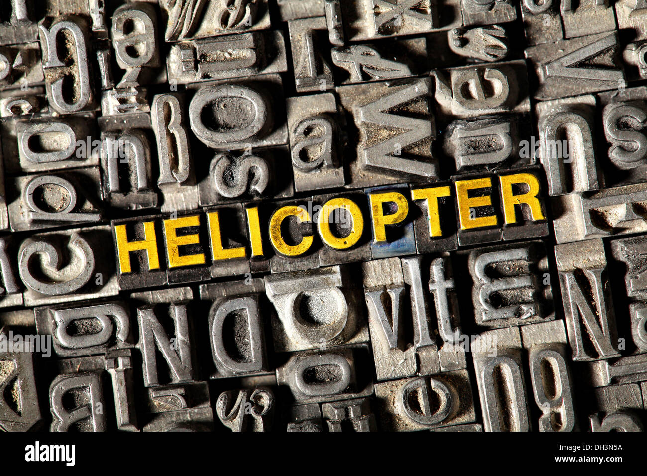 Old lead letters forming the word "HELICOPTER Stock Photo - Alamy