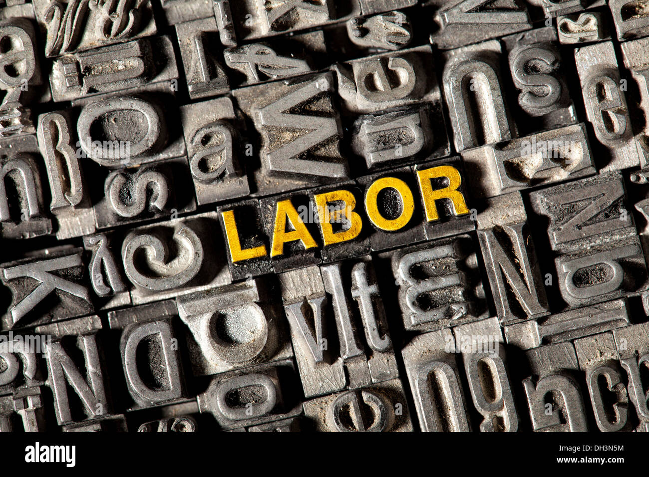 Old lead letters forming the word LABOR Stock Photo - Alamy