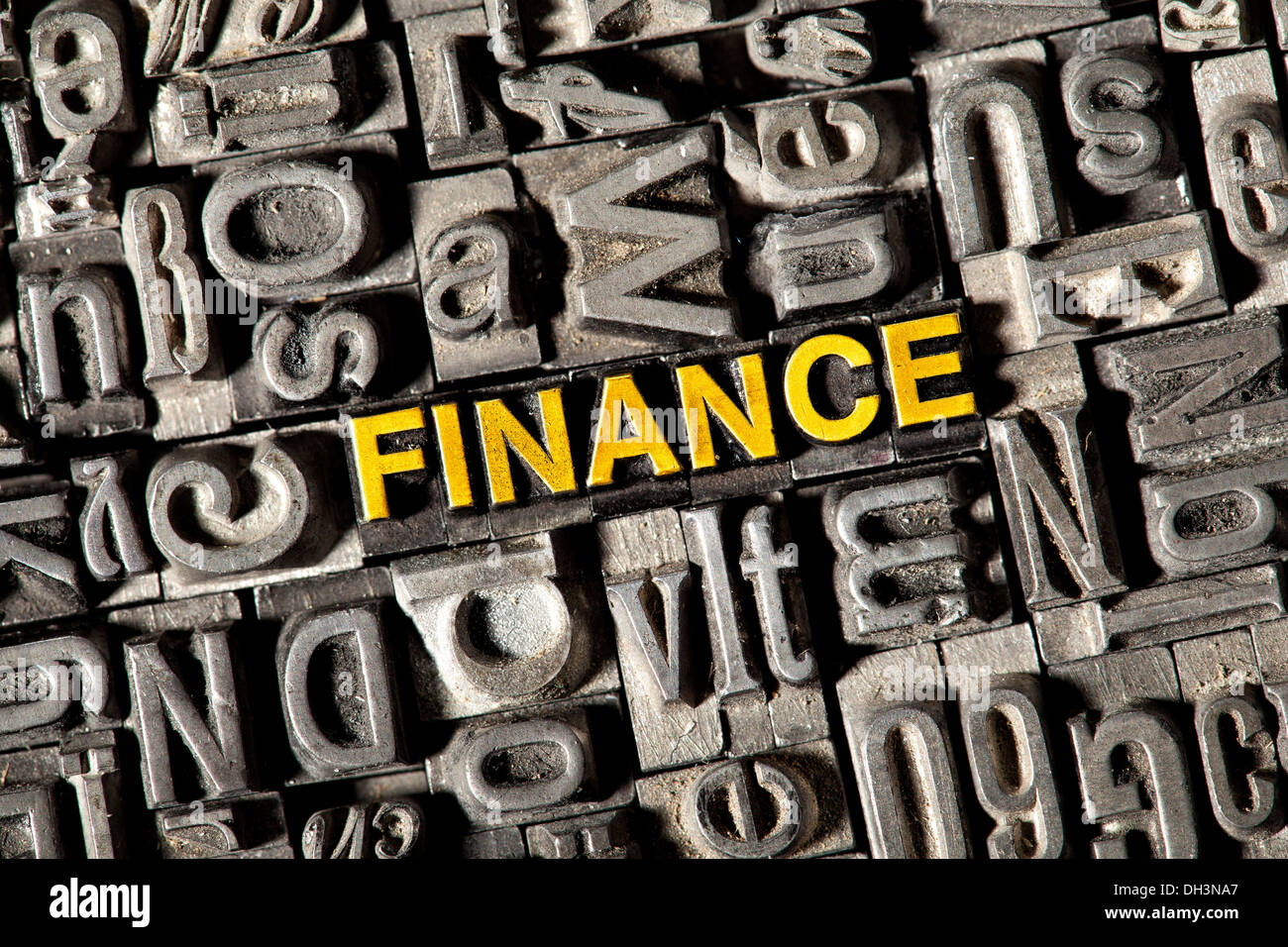 Old lead letters forming the word FINANCE Stock Photo - Alamy