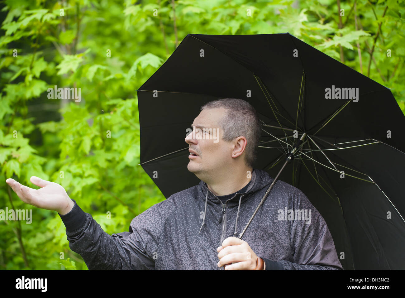 Umbrella with man hi-res stock photography and images - Alamy