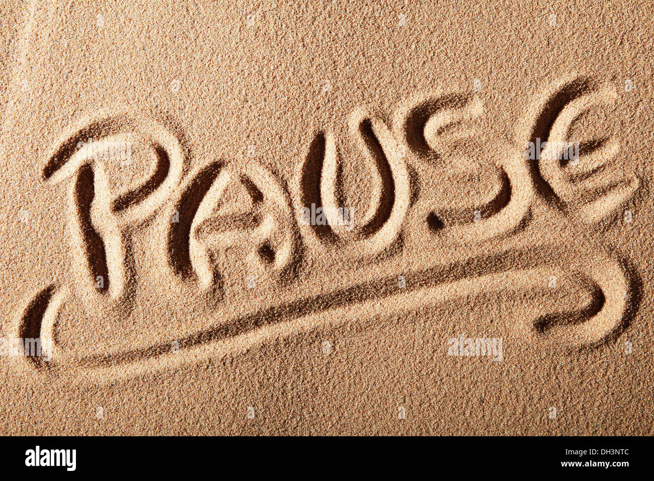 Writing in the sand "PAUSE Stock Photo - Alamy