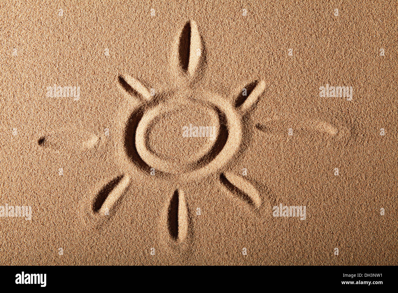 Sun painted in the sand Stock Photo - Alamy
