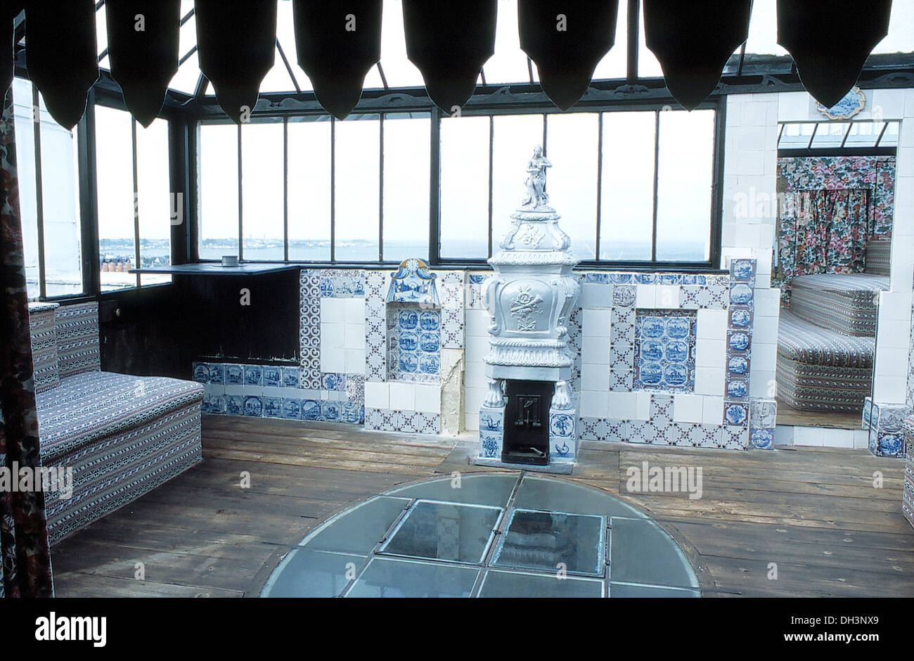 Ornate, Moroccan style fireplace in conservatory style room with blue ...