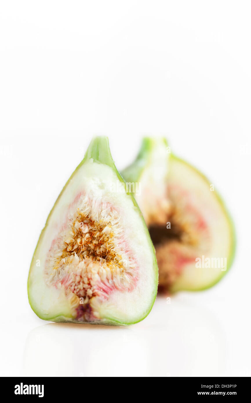 Fig with section cut out isolated on white background vertical ...