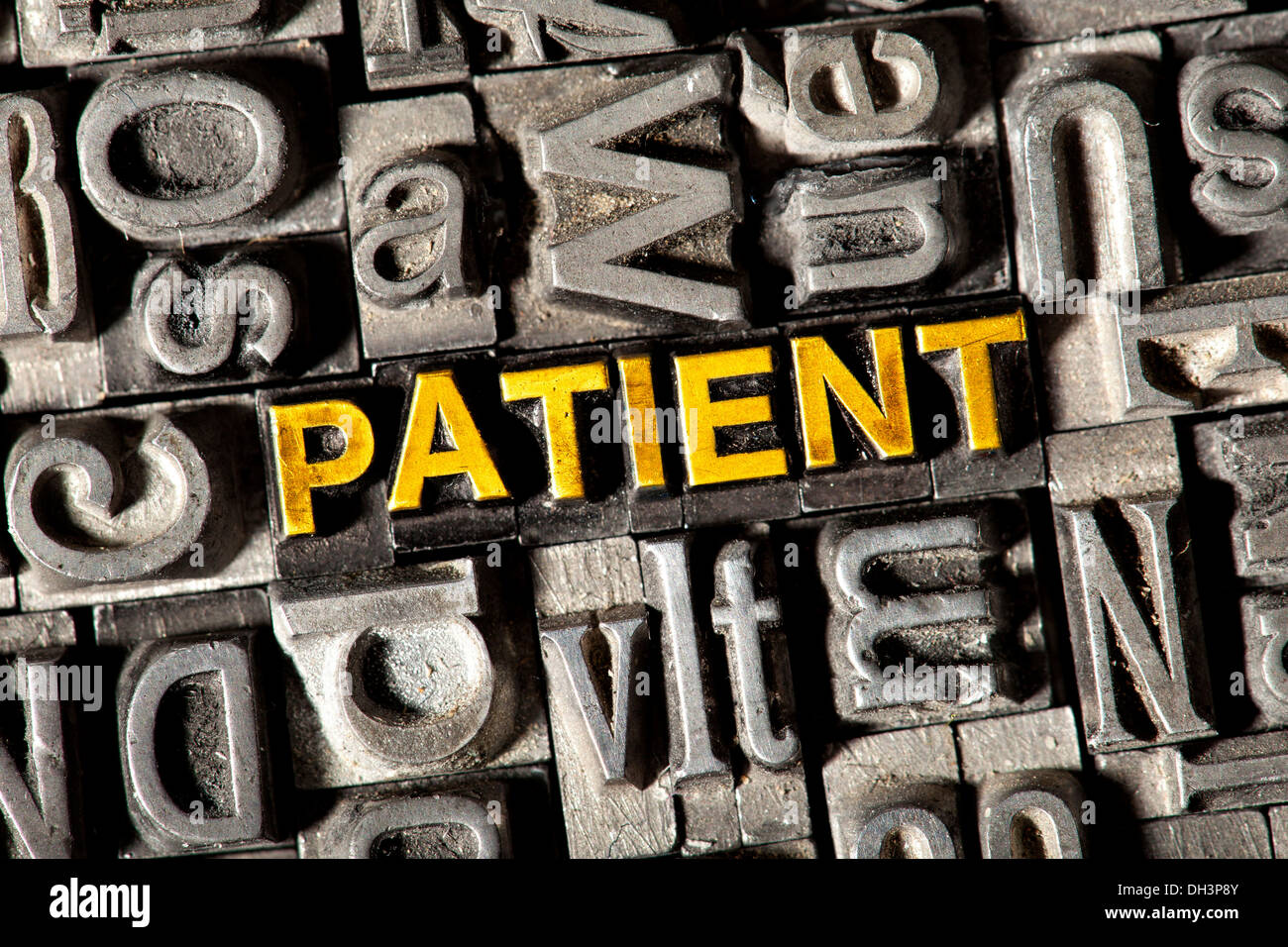 Old lead letters forming the word PATIENT Stock Photo - Alamy