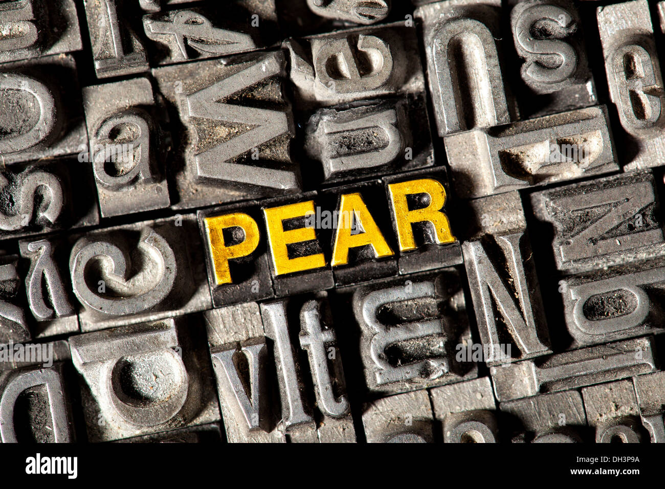 Old lead letters forming the word PEAR Stock Photo - Alamy