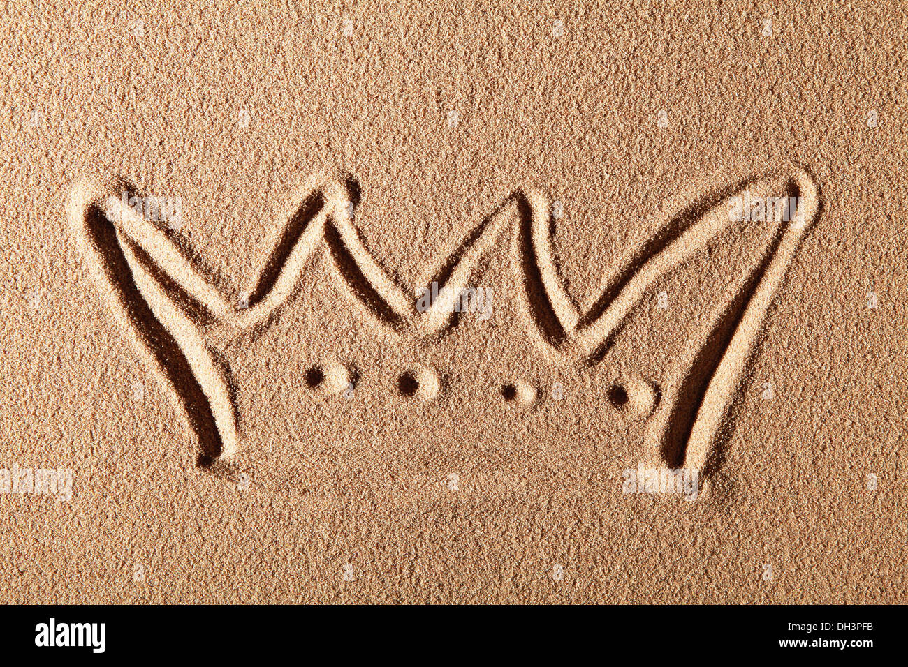 Crown painted in the sand Stock Photo - Alamy